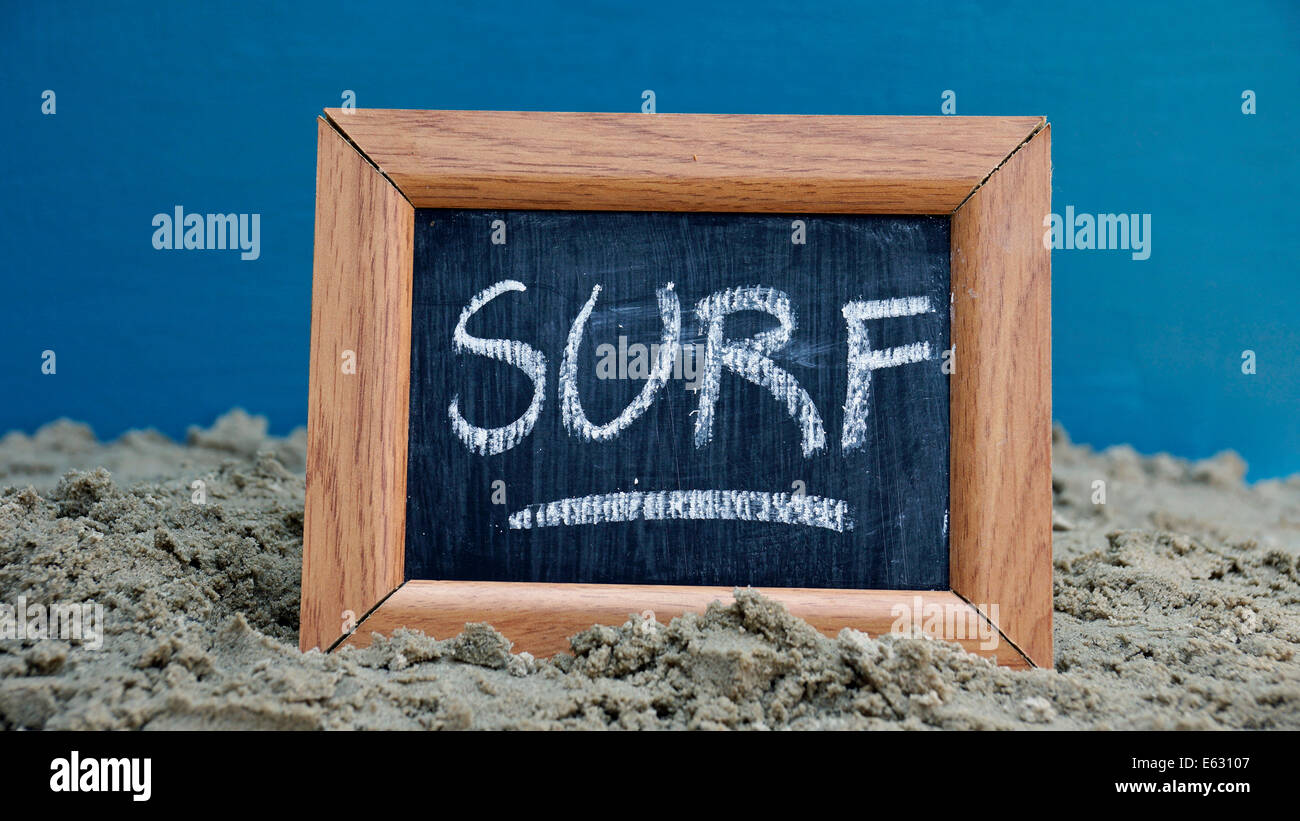 Surf written on a chalkboard at the beach Stock Photo - Alamy