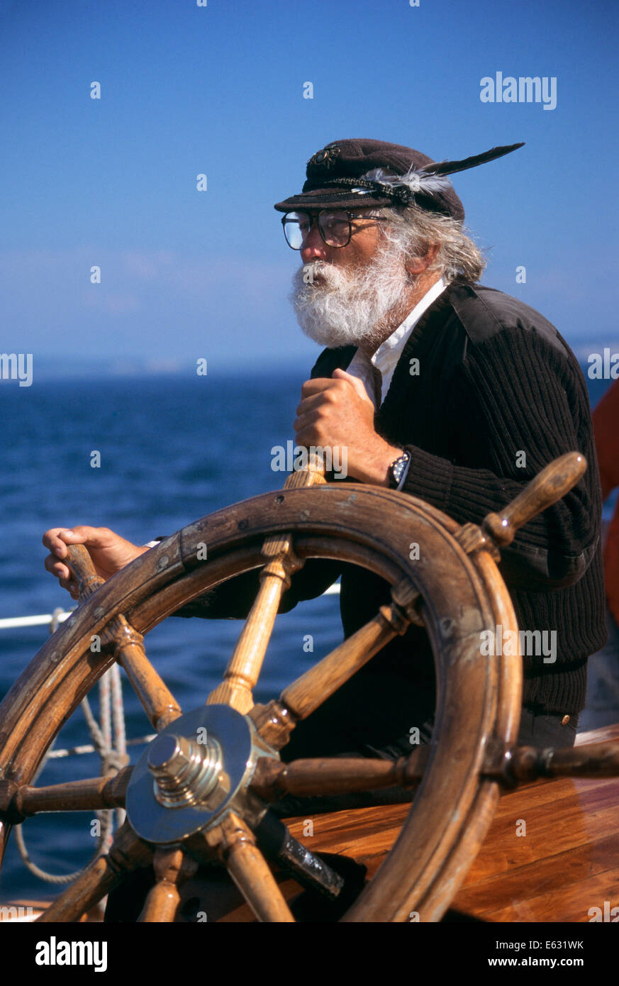 1990s MATURE BEARDED MAN AT WHEEL OF SHIP Stock Photo - Alamy