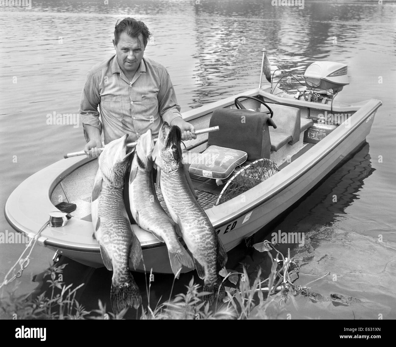 Man in water holding Black and White Stock Photos & Images - Alamy