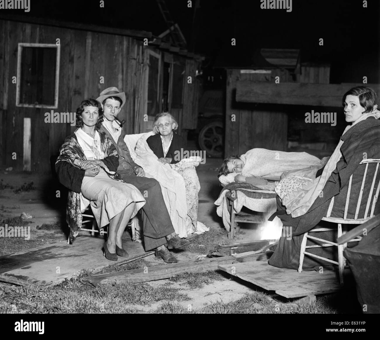 1930s MARCH 10, 1933 EARTHQUAKE AFTERMATH GROUP OF PEOPLE SITTING BY ...