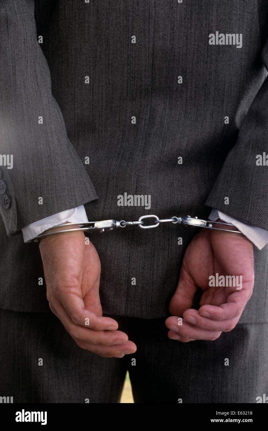Handcuff behind back man old hi-res stock photography and images - Alamy