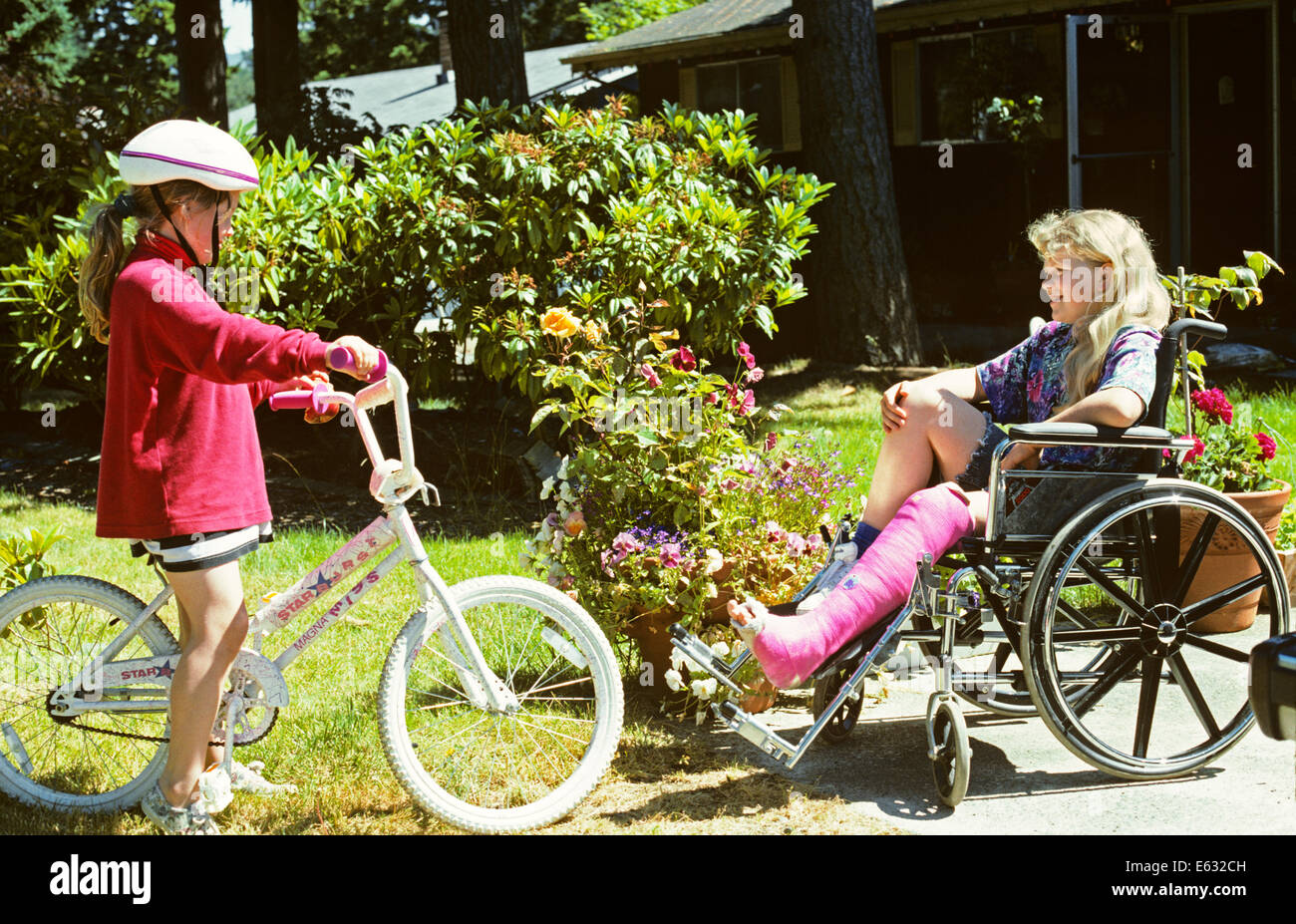 Two girls one wheelchair hi-res stock photography and images - Alamy