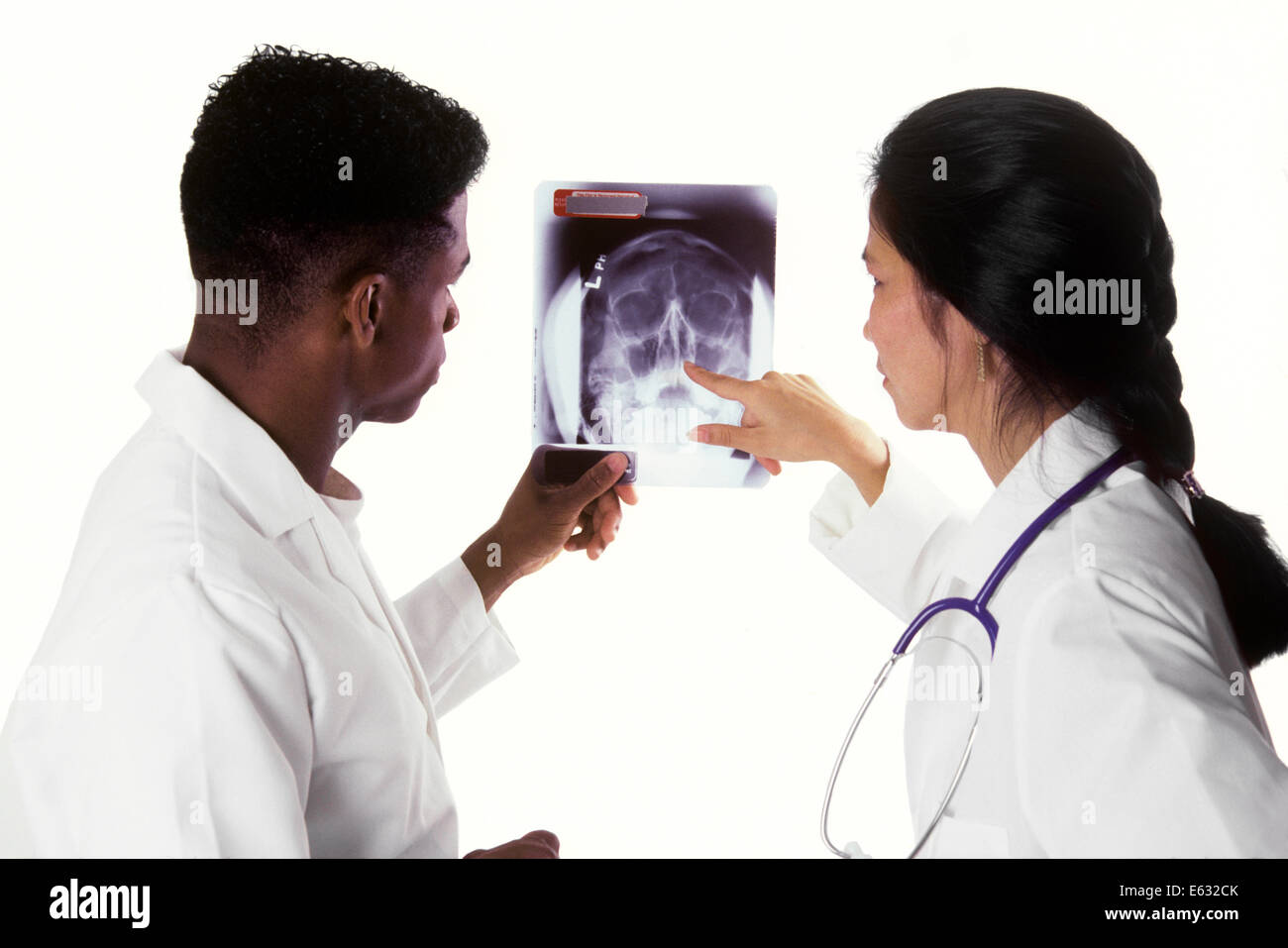 TWO DOCTORS VIEWING HEAD X-RAY Stock Photo - Alamy