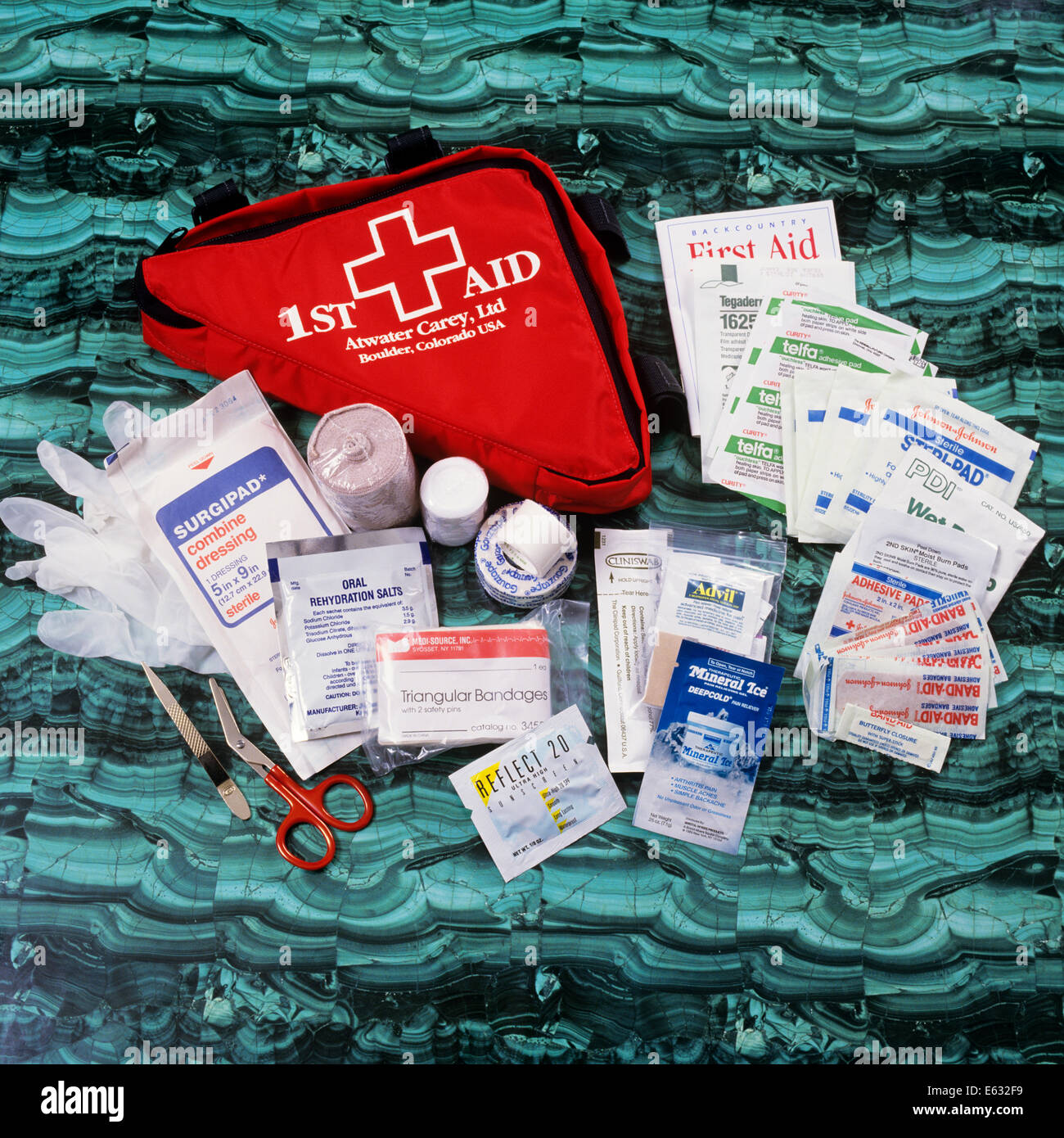 RED FIRST AID KIT WITH CONTENTS OF KIT ON DISPLAY Stock Photo - Alamy