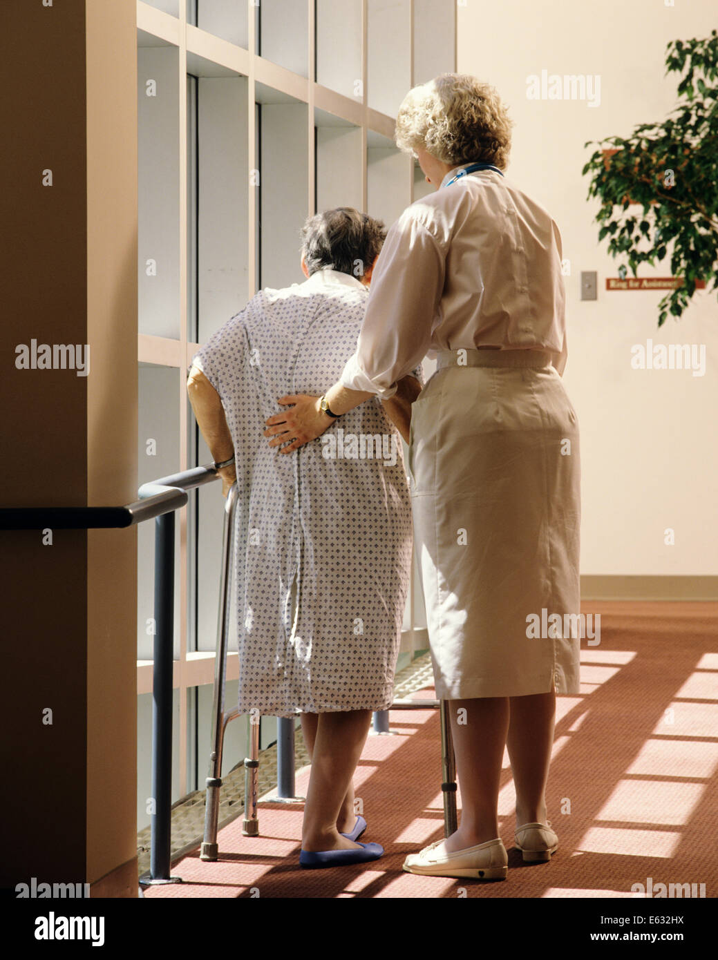 Two nurses helping patient hi-res stock photography and images - Alamy