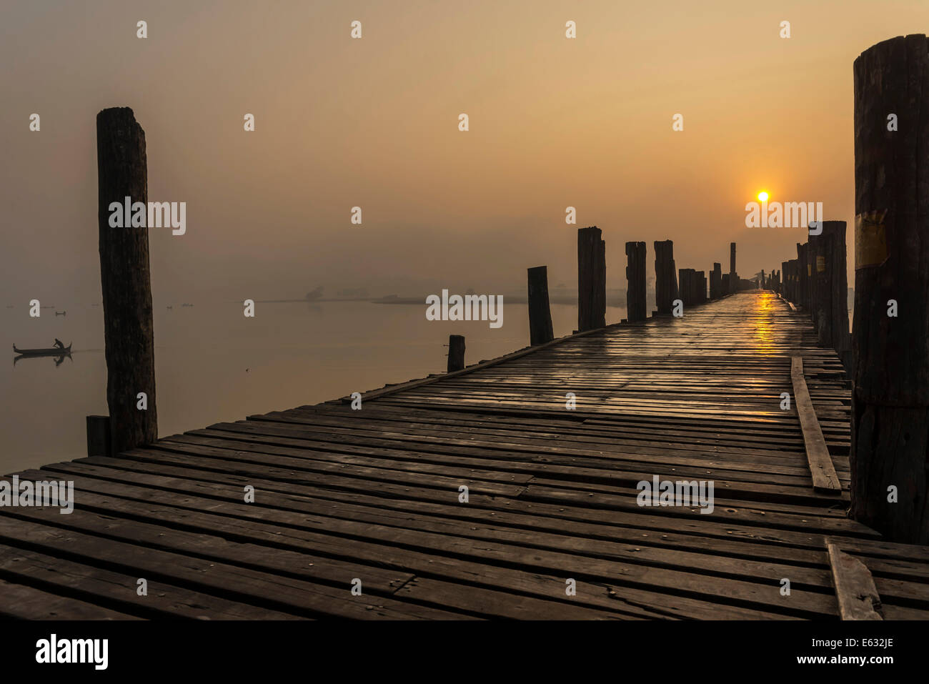 Teak bridge at sunrise, U Bein bridge across Thaungthaman Lake ...