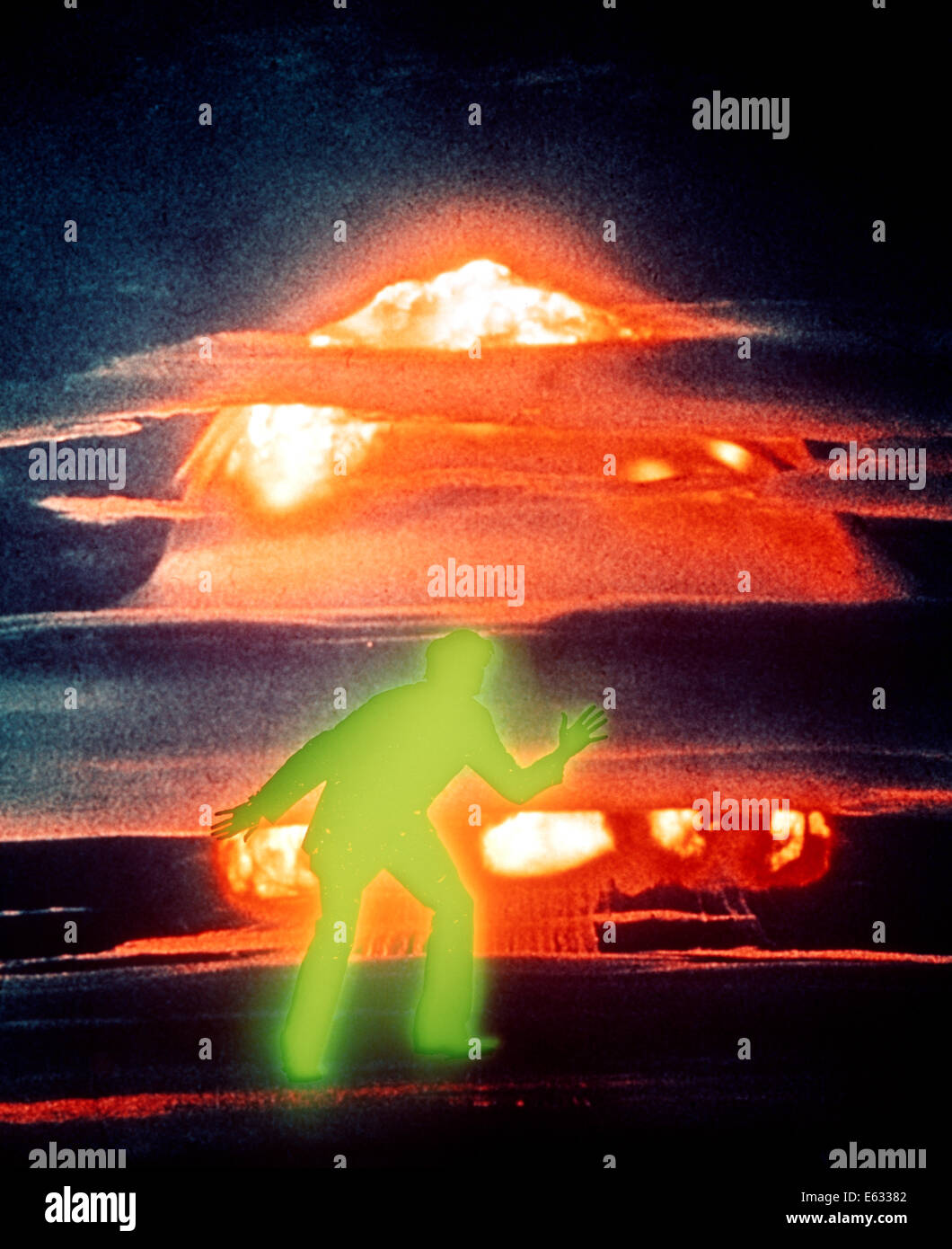 1970s GLOWING GREEN SHADOW ANONYMOUS MAN AGAINST RED ORANGE GLOWING ...