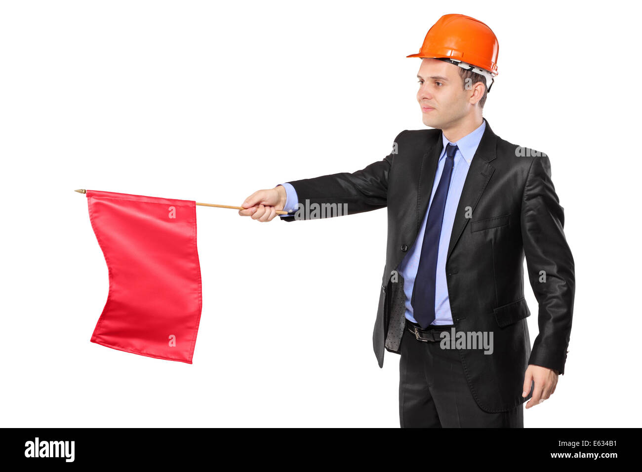 Construction worker holding a red flag isolated on white background ...
