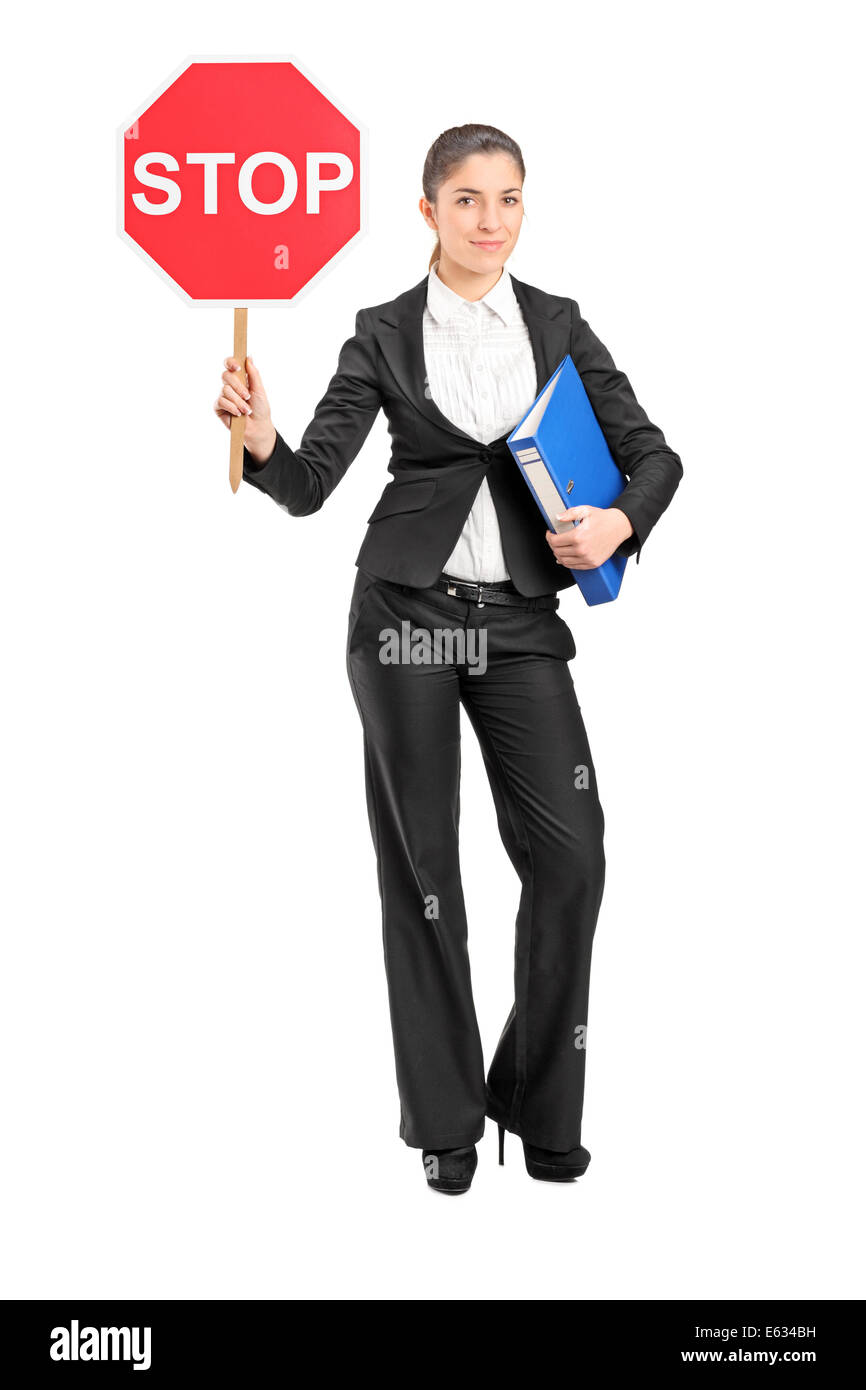 Full length portrait of a businesswoman holding a stop sign Stock Photo ...
