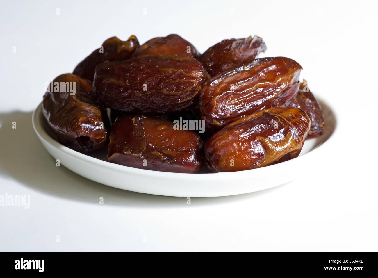 Dates on white background Stock Photo - Alamy