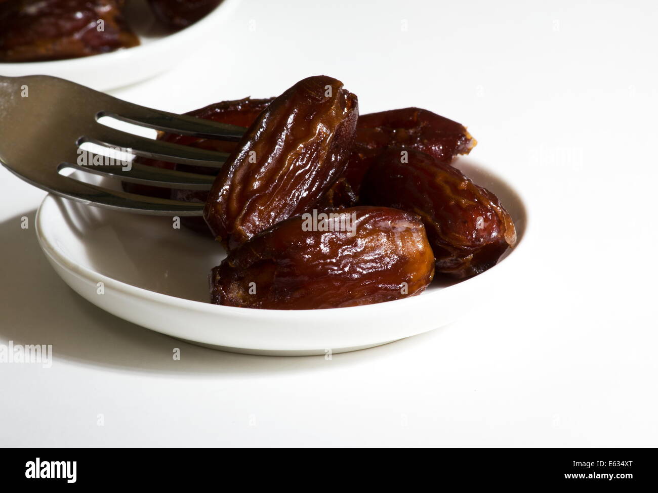 Dates on white background Stock Photo - Alamy