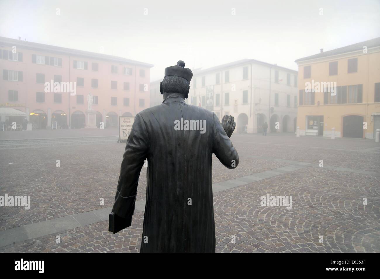 Brescello (Reggio Emilia, Italy), the statue of Don Camillo, in front ...