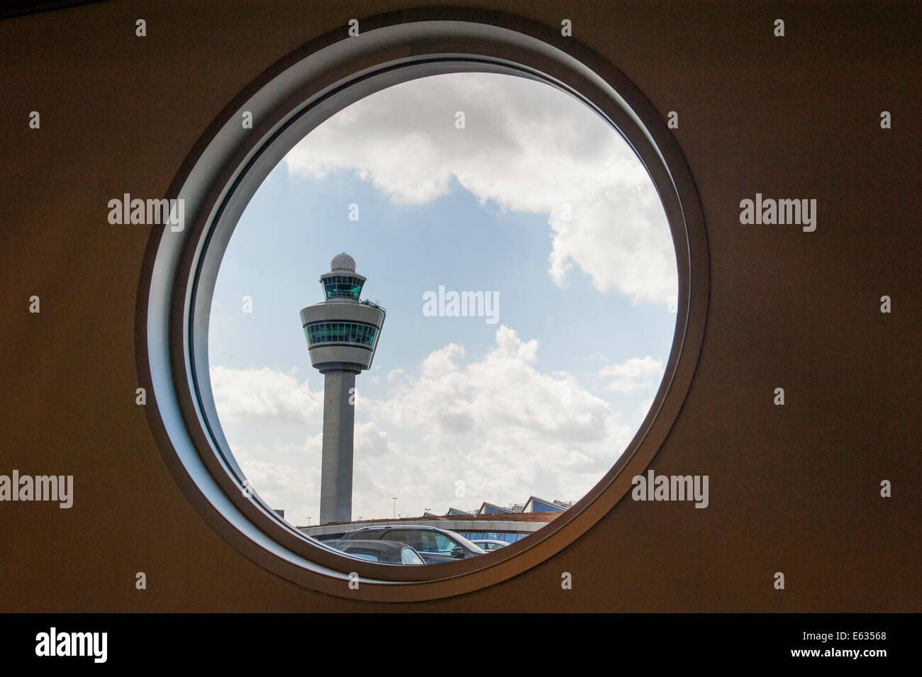 Airport command tower seen throug a window of the terminal Stock Photo ...