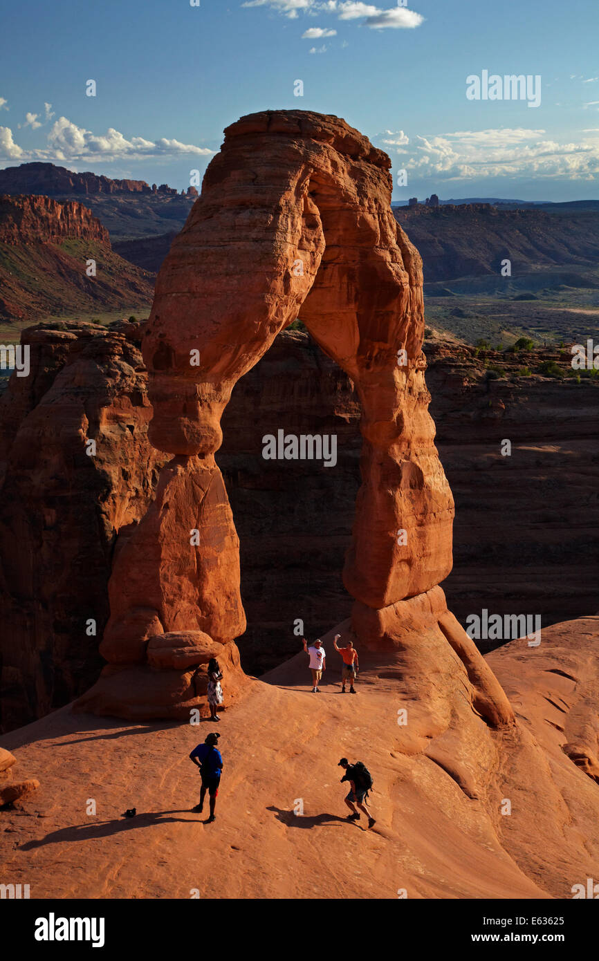 Delicate Arch (65 ft / 20 m tall iconic landmark of Utah), and tourists ...