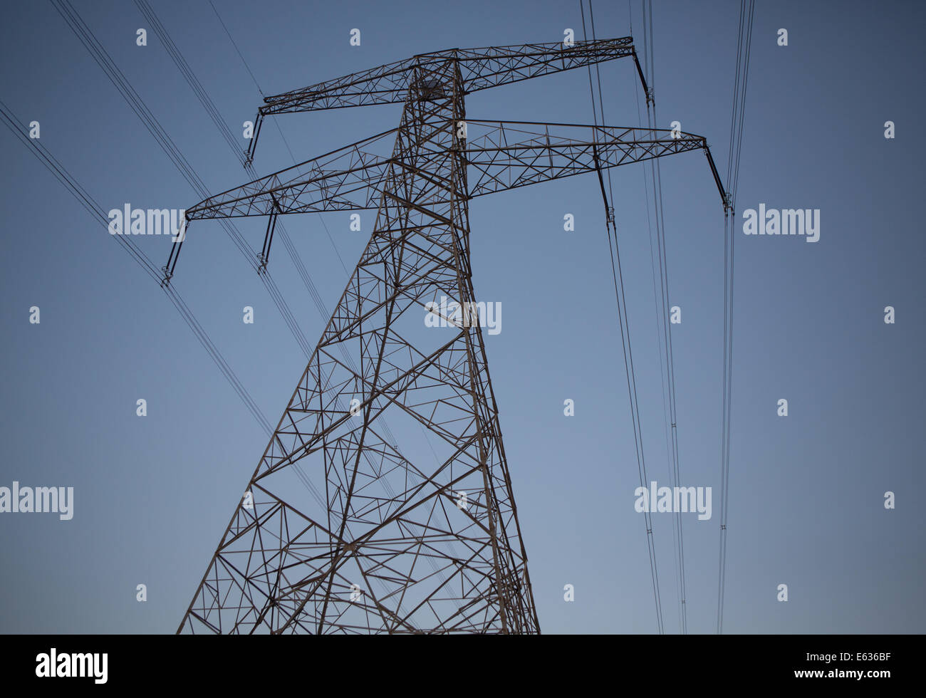 Electricity pylon looms overhead at dusk, Dibba, Fujairah, United Arab ...