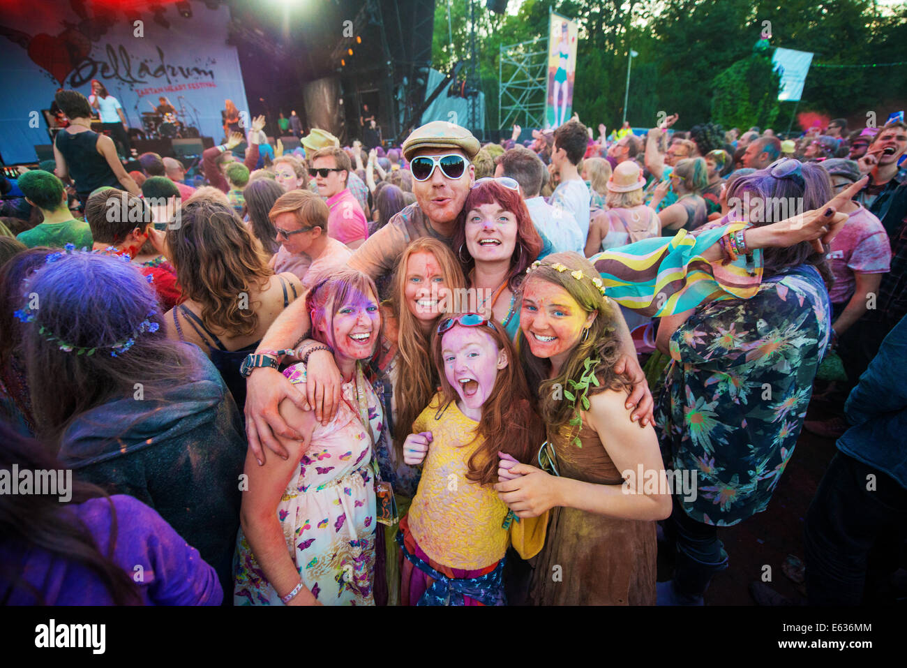 Festival goers throw coloured powder at the Belladrum Tartan Heart ...
