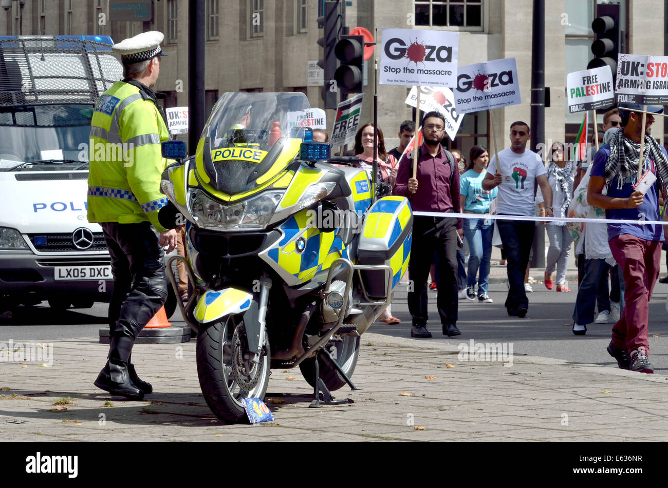 Motorcycle police officer on duty during the March For Gaza, London ...