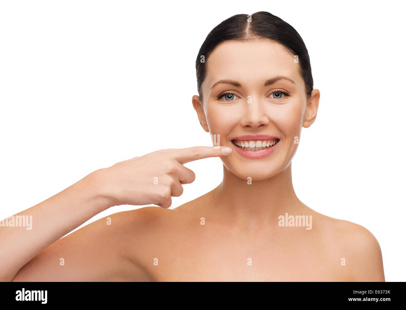 young calm woman pointing to her mouth Stock Photo - Alamy