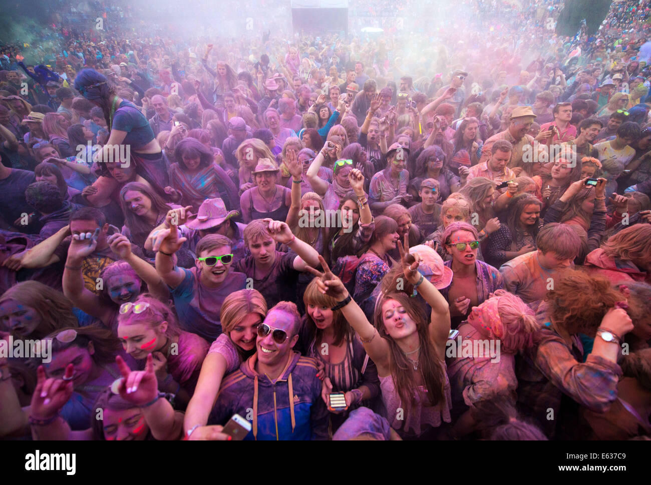 Festival goers throw coloured powder at the Belladrum Tartan Heart ...