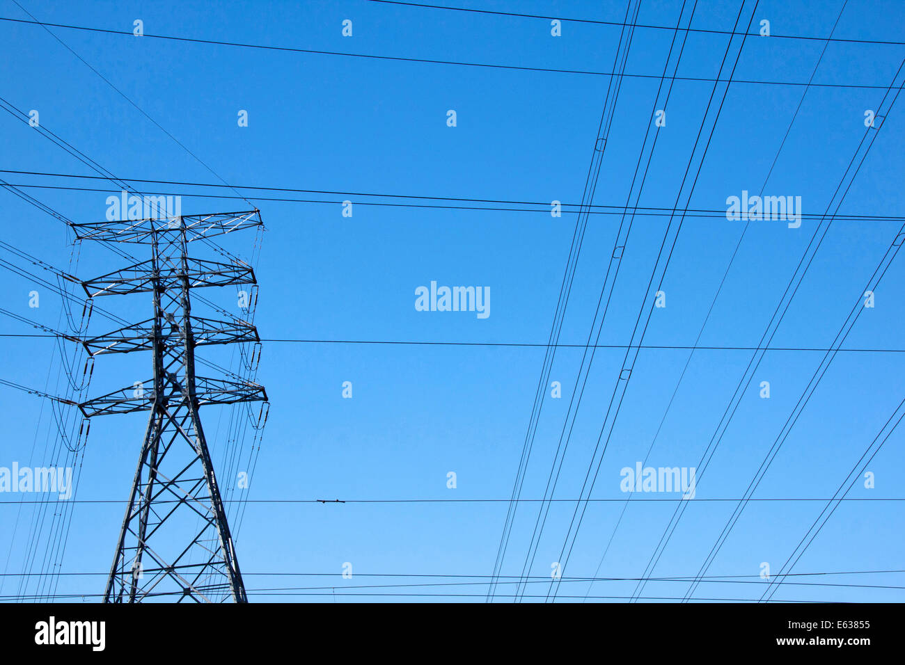 electricity pylon with power cable network against blue sky Stock Photo ...