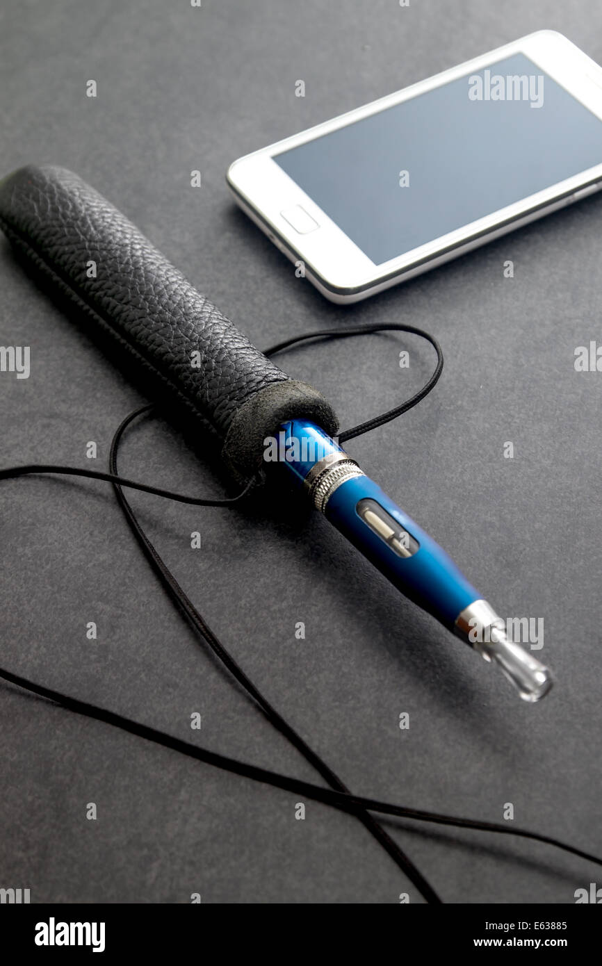 e cigarette and smart phone on table Stock Photo - Alamy