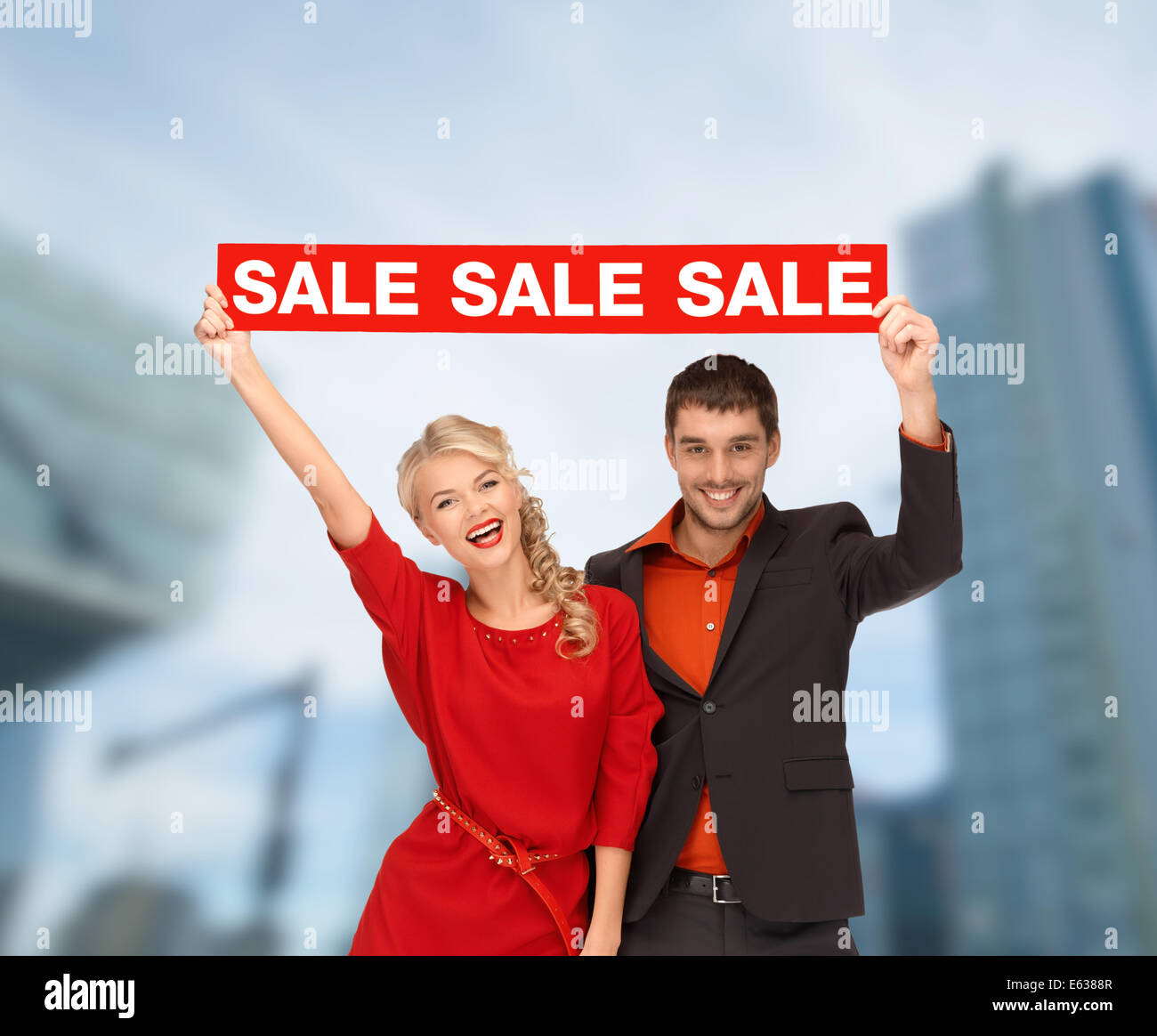 smiling woman and man with red sale sign Stock Photo - Alamy
