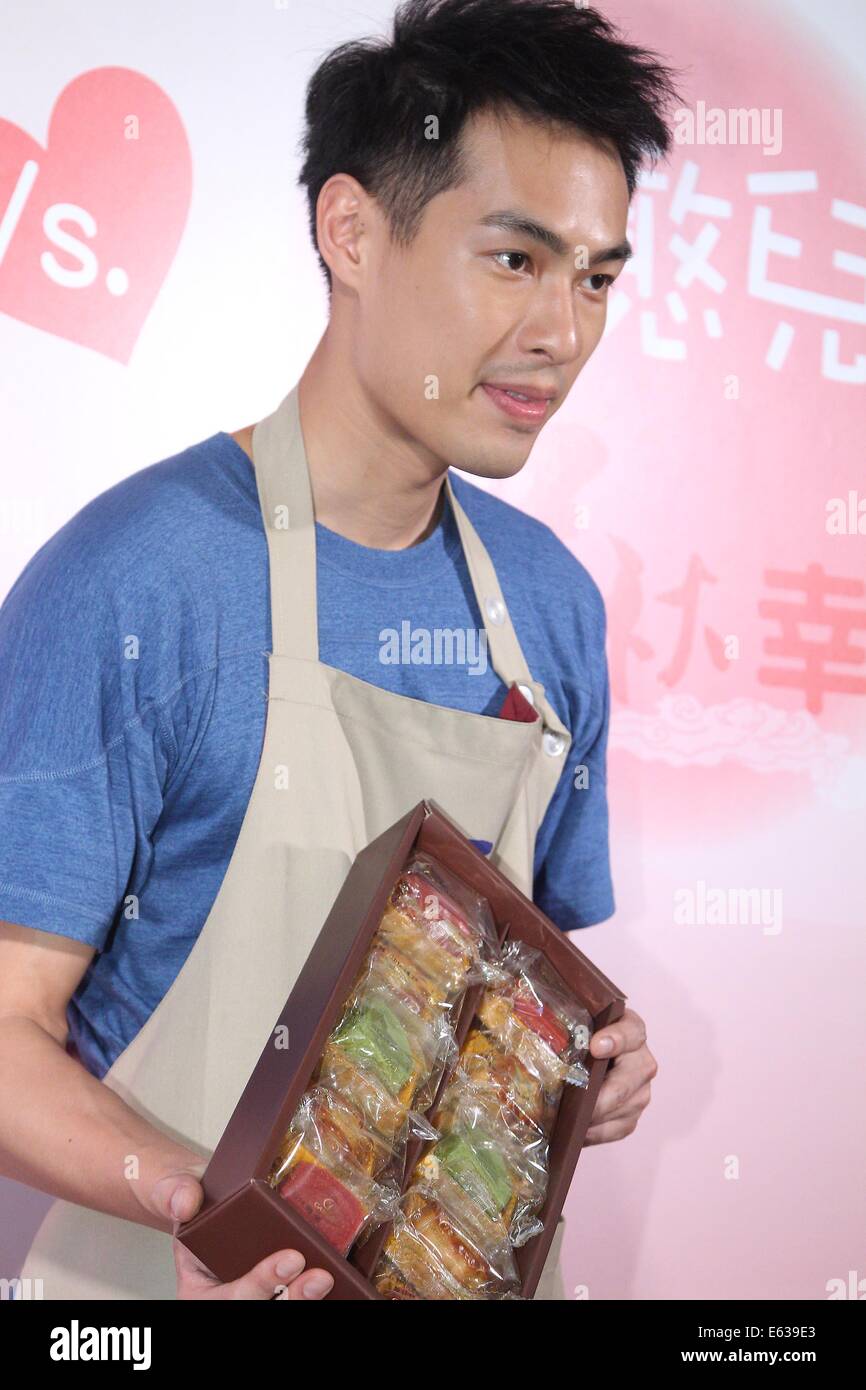 Taipei. 12th Aug, 2014. Actor Tony Yang makes mooncake for benifit ...