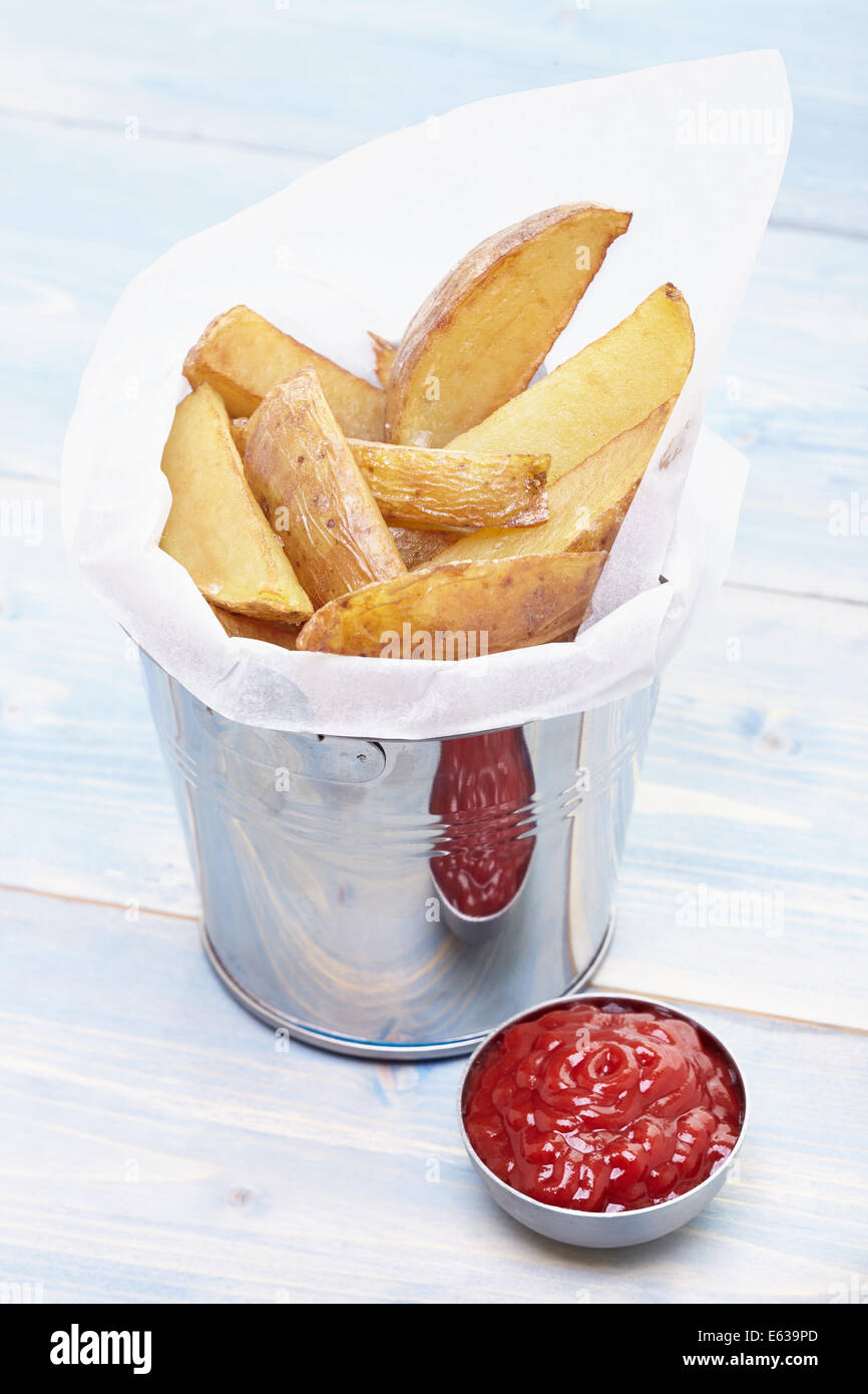 Homemade Fries in a small metal bucket with and ketchup Stock Photo - Alamy