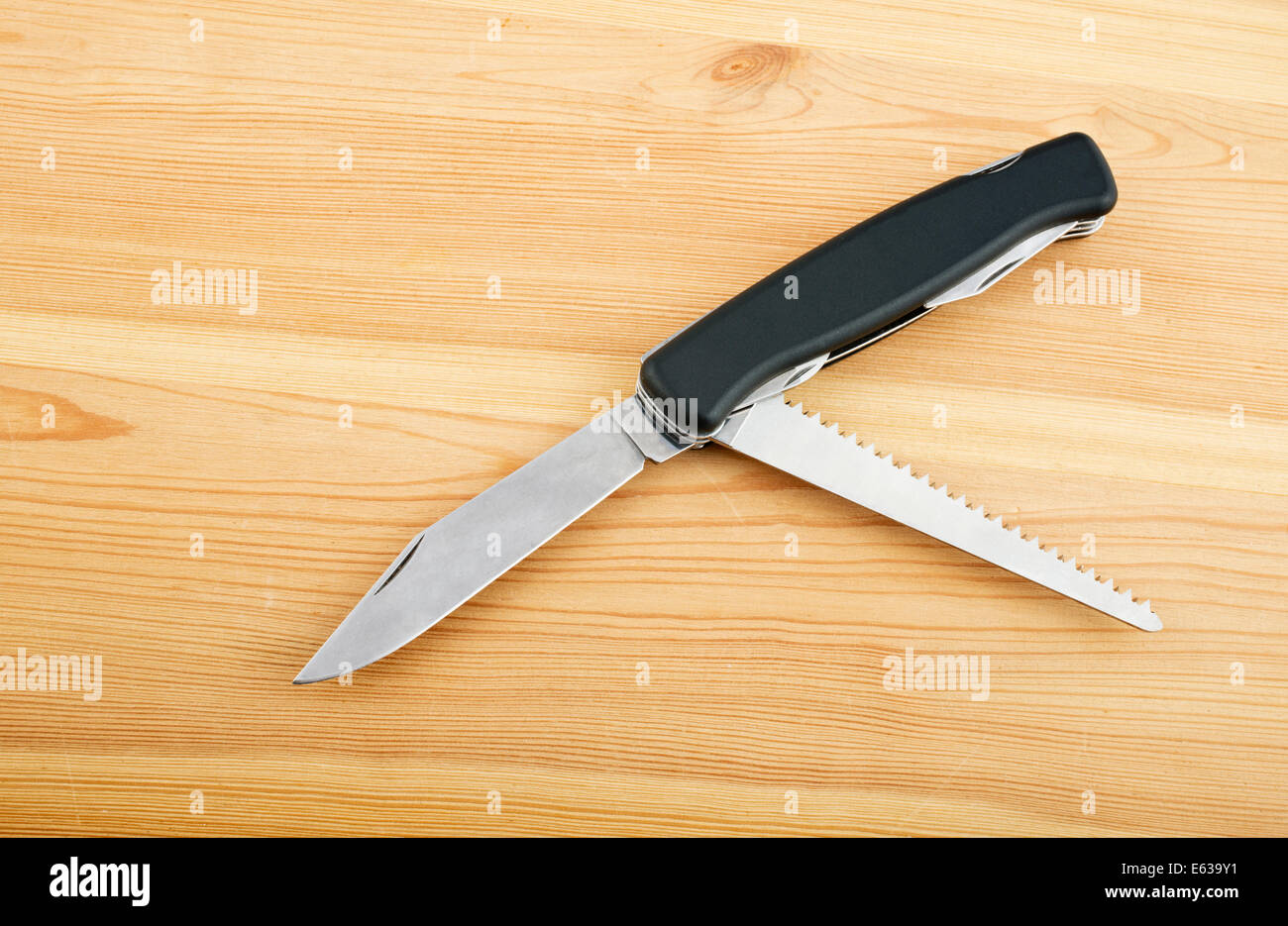 a pocket knife on the wooden desk Stock Photo - Alamy