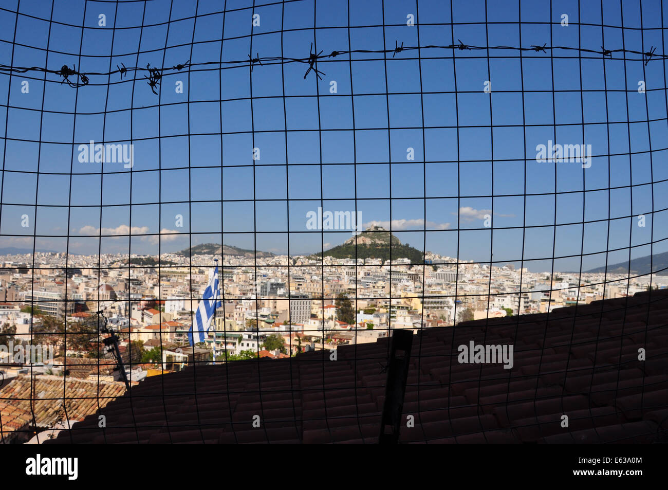 The city of Athens, Greece viewed through fence grid squares background ...
