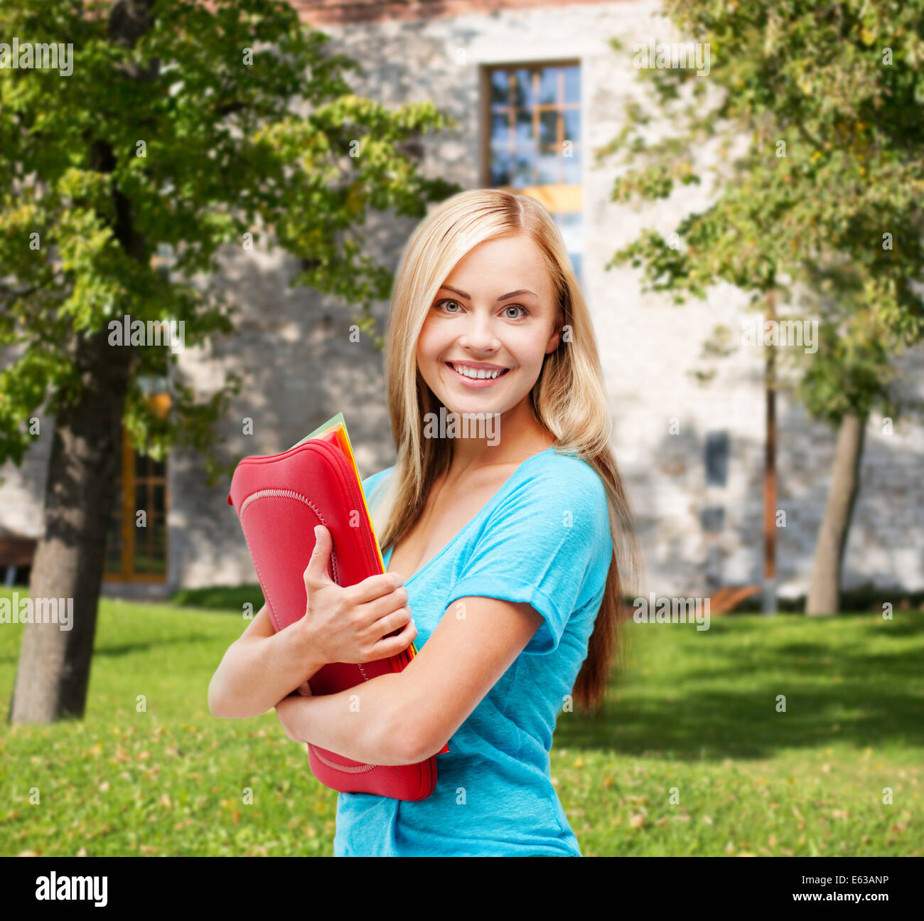 smiling student with folders Stock Photo - Alamy