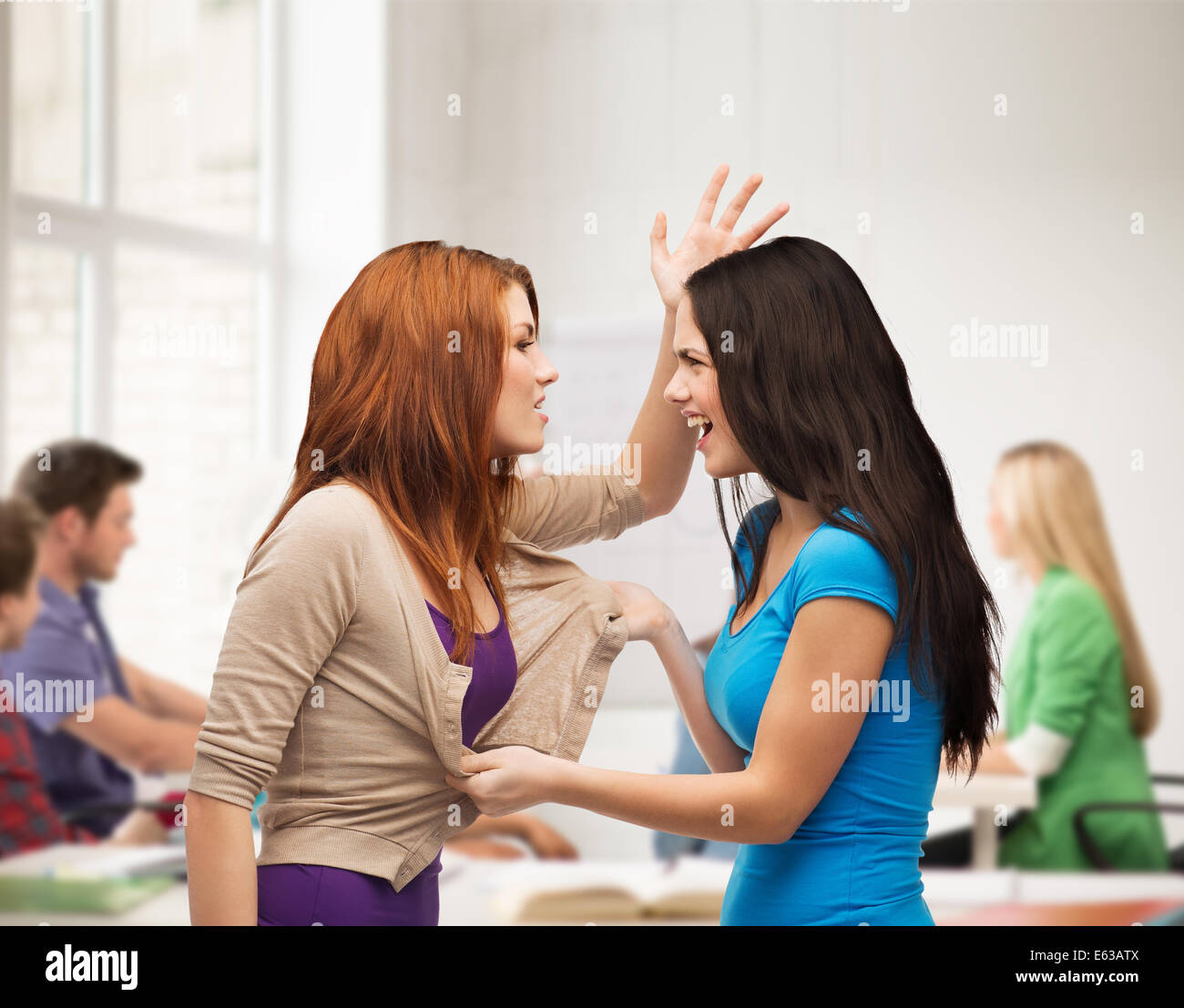 two teenagers having a fight and getting physical Stock Photo - Alamy