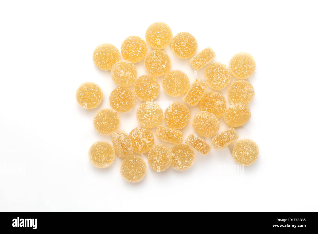 Yellow jelly candy on white background Stock Photo - Alamy