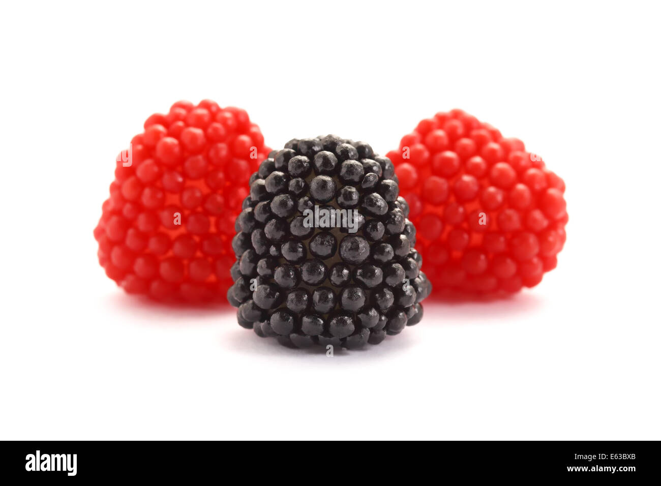 Berry candy on white background Stock Photo - Alamy