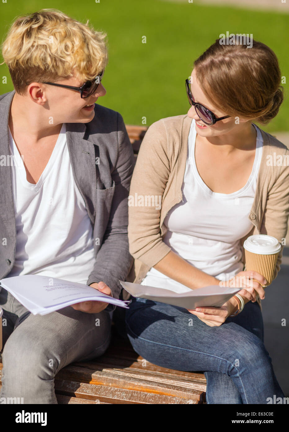 two students with books, notebooks and folders Stock Photo - Alamy