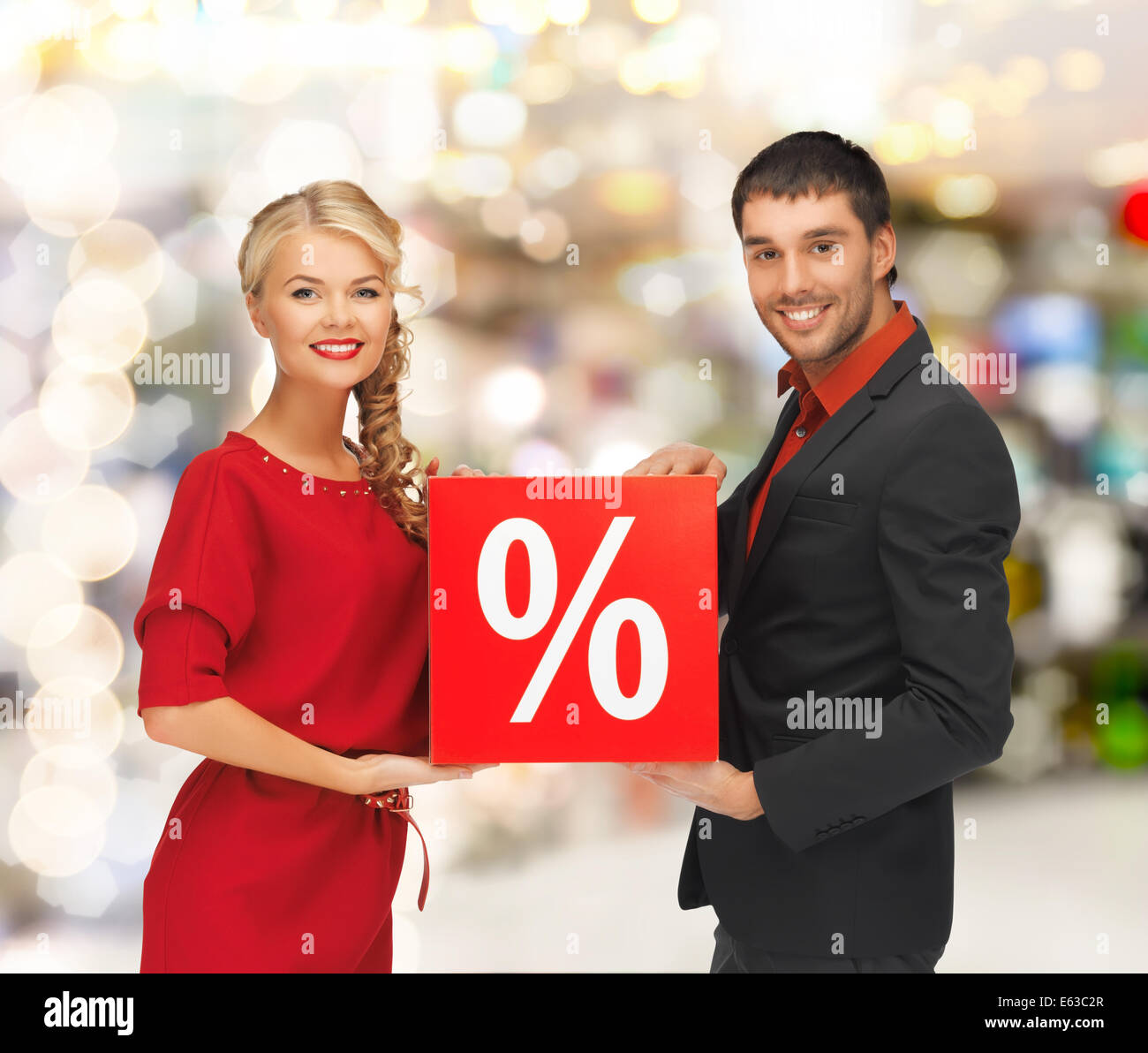 smiling man and woman with percent sign Stock Photo - Alamy