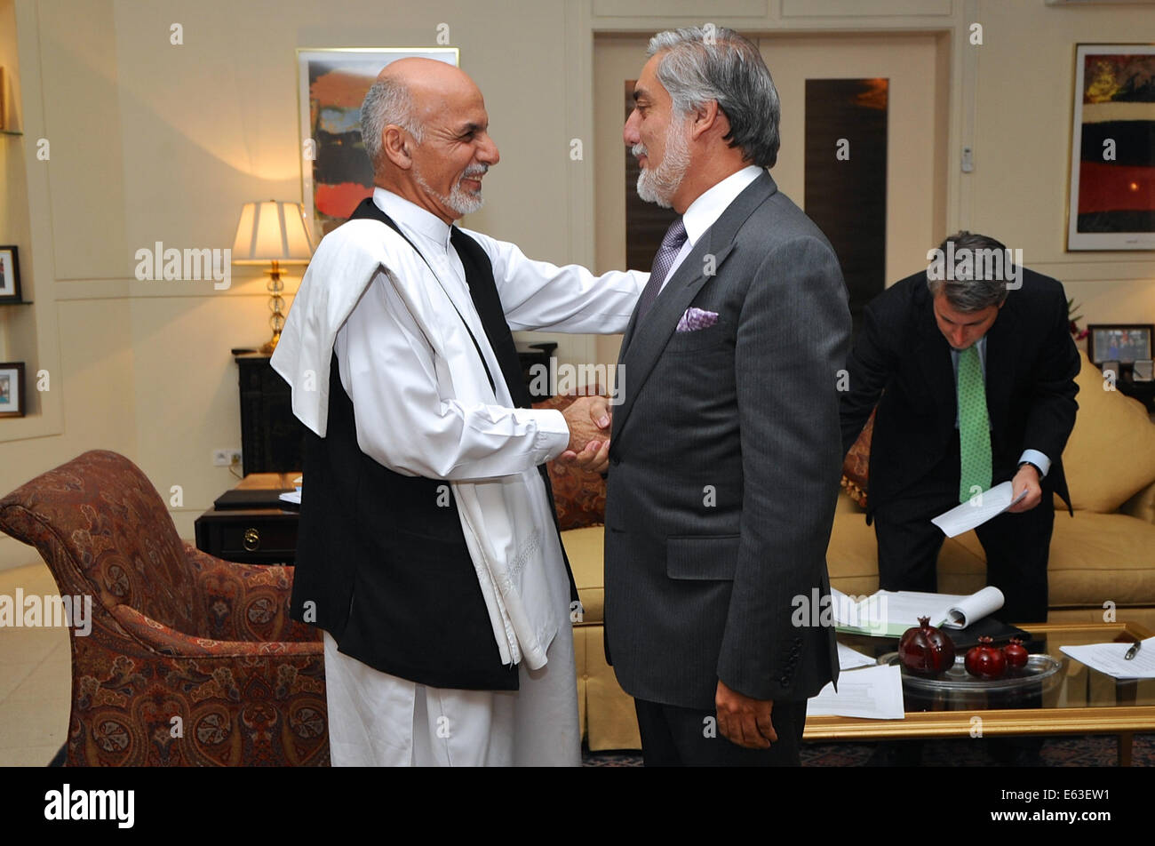 Afghan presidential candidate Ashraf Ghani, left, shakes hands with ...