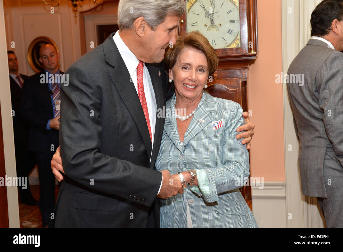 U.S. Secretary of State John Kerry greets Nancy Pelosi, Minority Leader ...