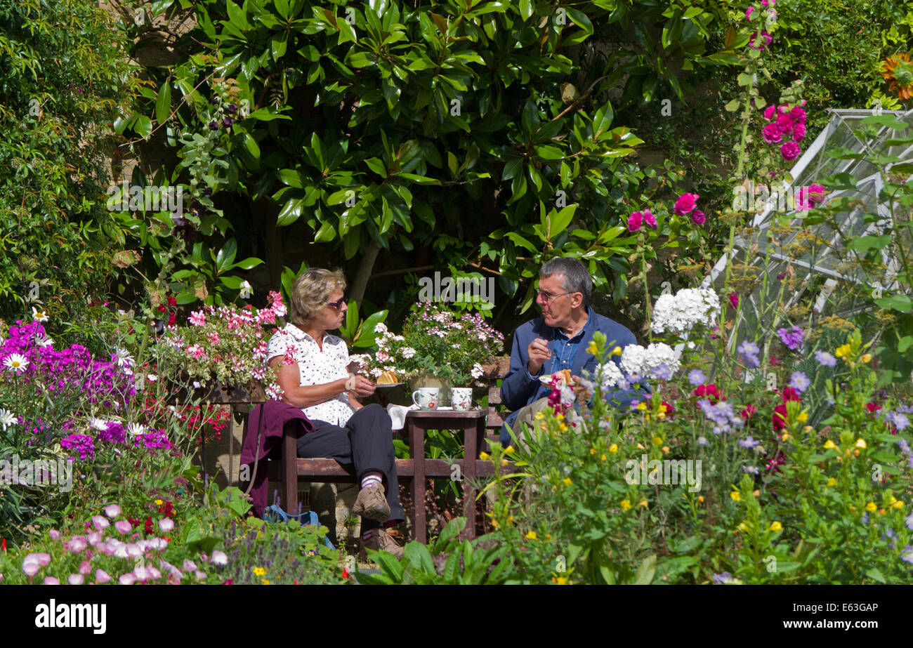 Woman enjoying afternoon tea hi-res stock photography and images - Alamy