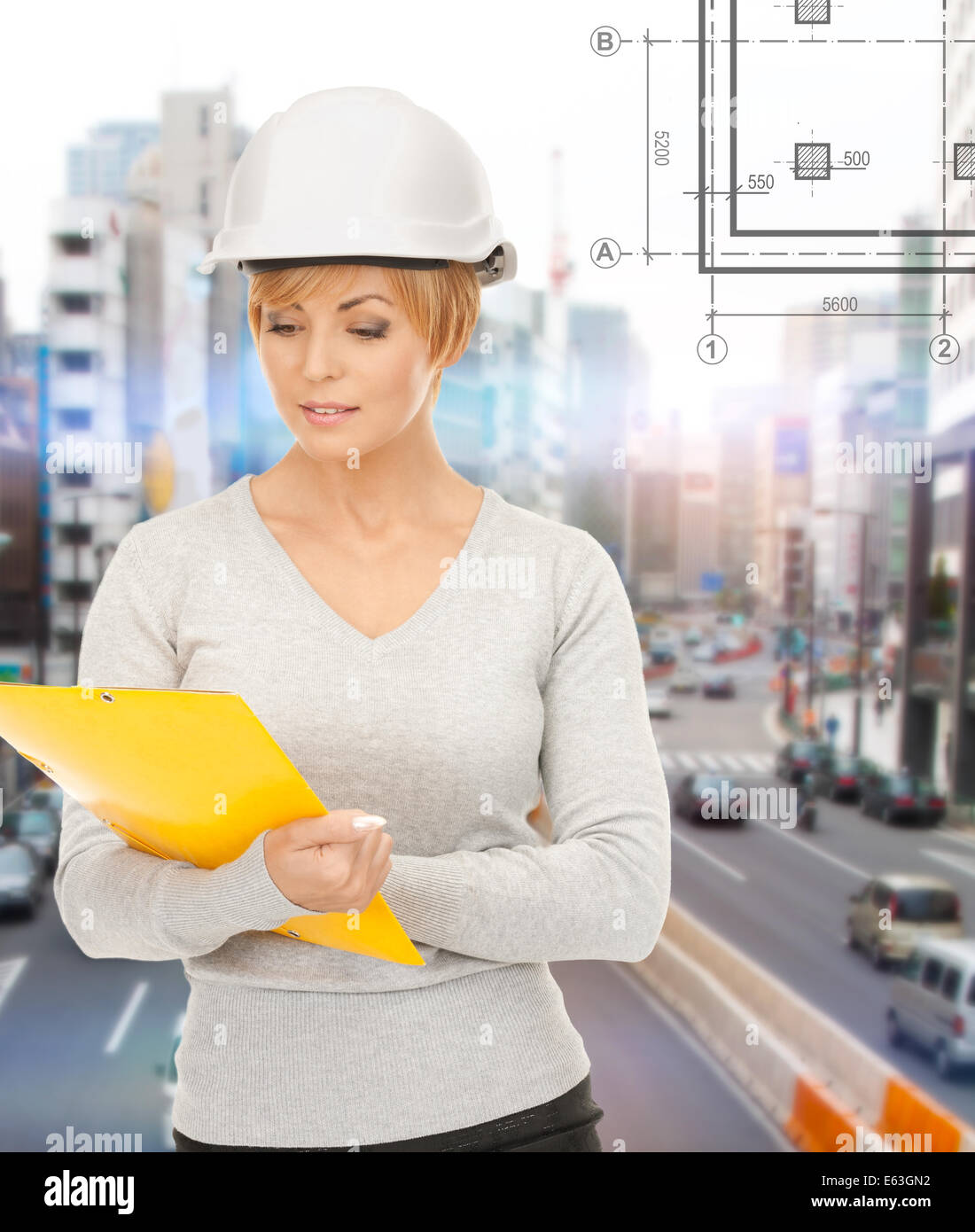 female contractor in helmet with folder Stock Photo - Alamy