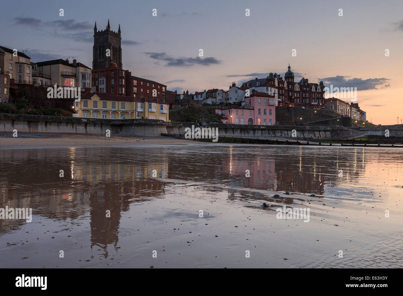 Cromer seafront buildings reflected in wet sand Stock Photo - Alamy