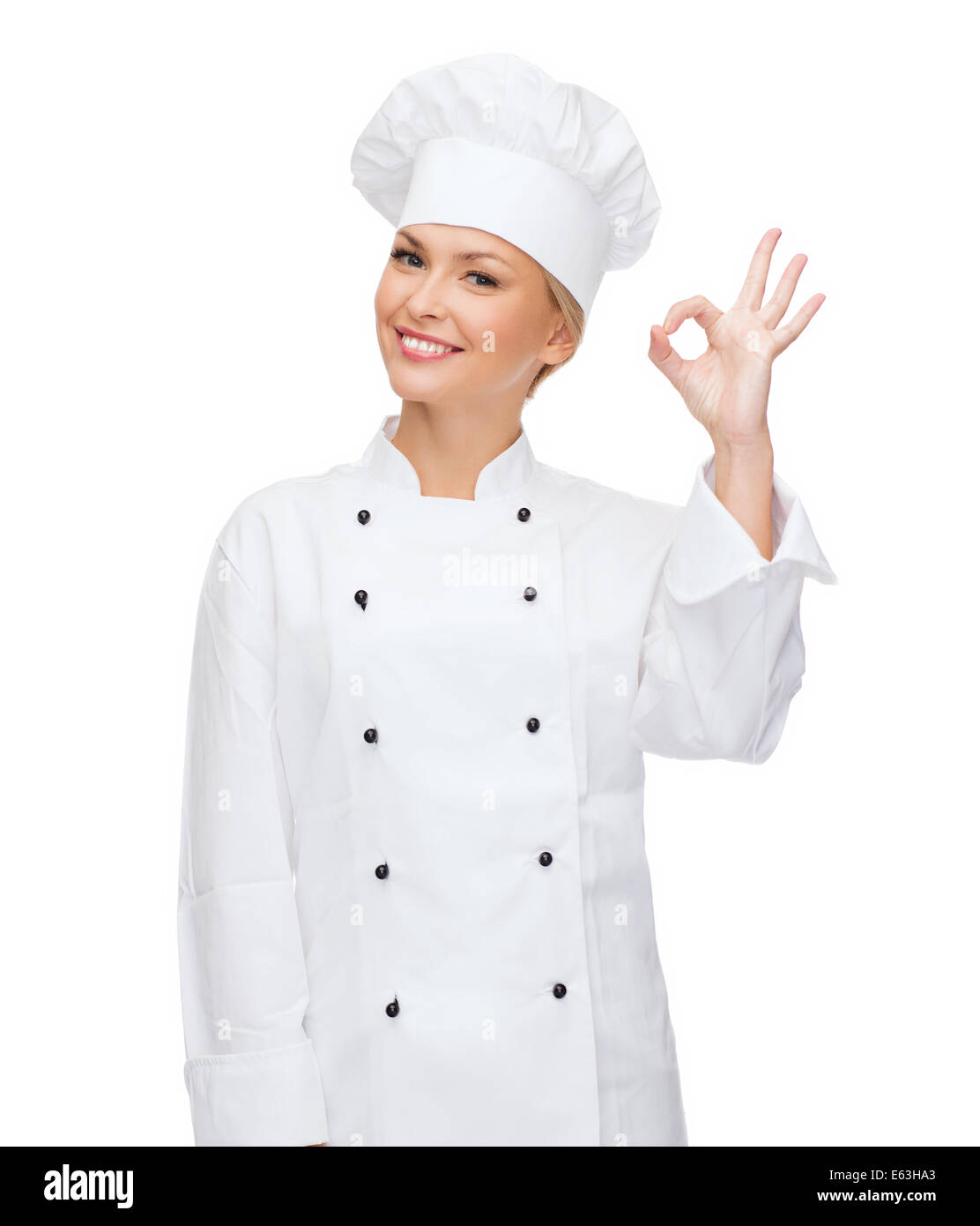 smiling female chef showing ok hand sign Stock Photo - Alamy