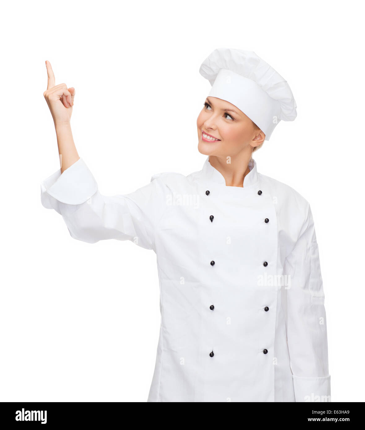 smiling female chef pointing finger to sonething Stock Photo - Alamy