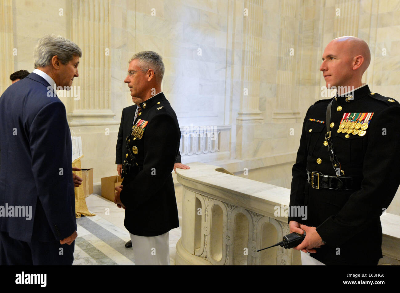 U.S. Secretary of State John Kerry speaks with a U.S. Marine Corps ...