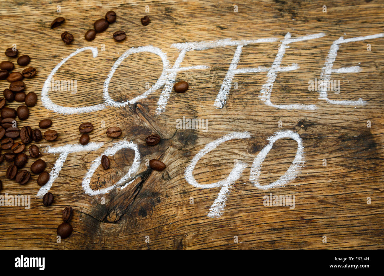 Coffee to go sign with coffee beans Stock Photo - Alamy