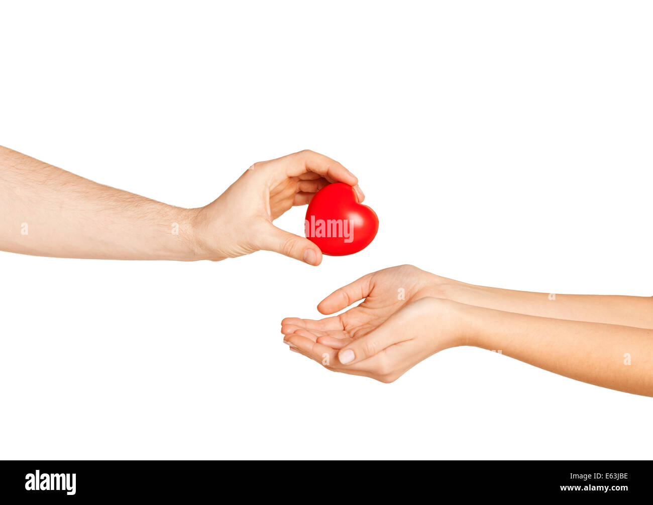 man hand giving red heart to woman Stock Photo - Alamy