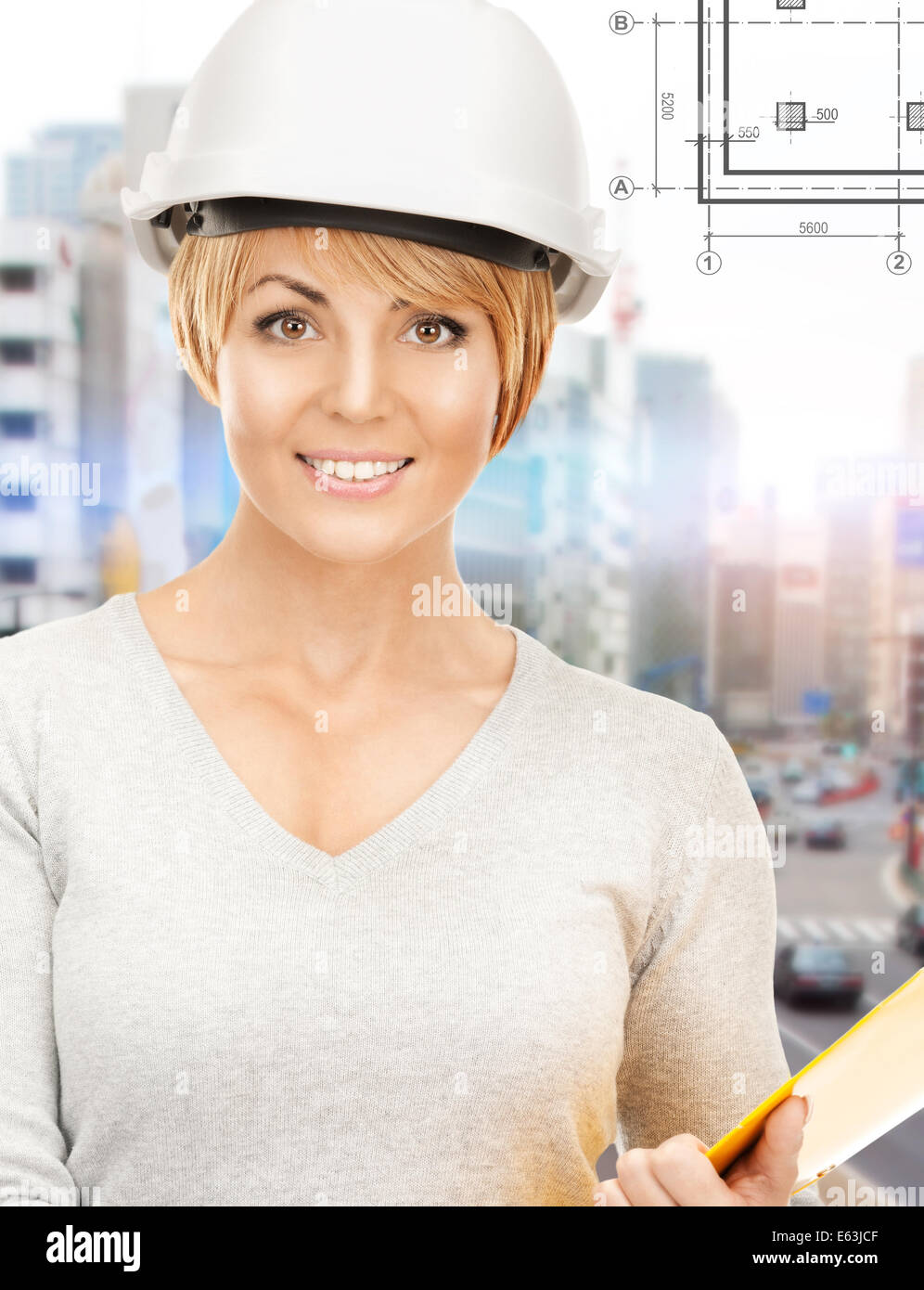 Female contractor in helmet folder hi-res stock photography and images ...