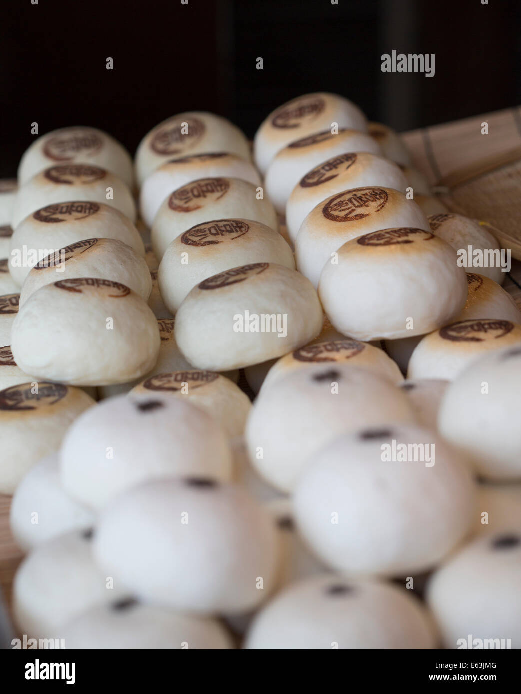 Stack of manju (dumplings) at a street vendor in Hida Takayama, japan ...