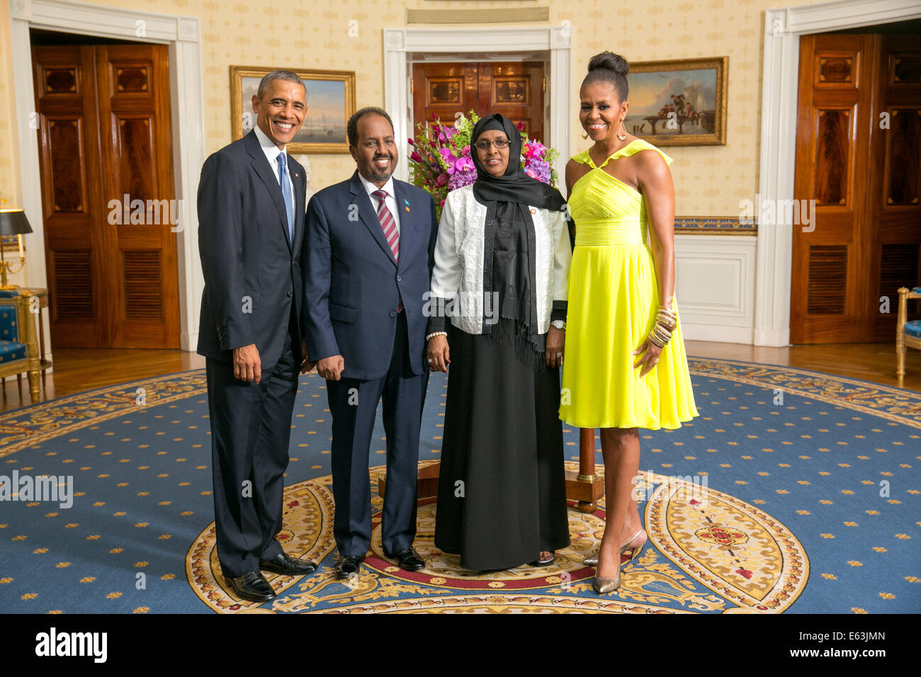 President Barack Obama and First Lady Michelle Obama greet His ...