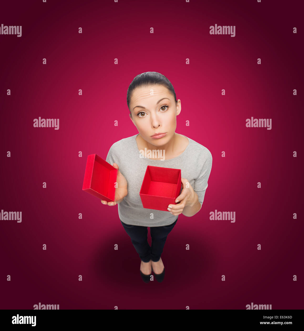 disappointed asian woman with empty red gift box Stock Photo - Alamy